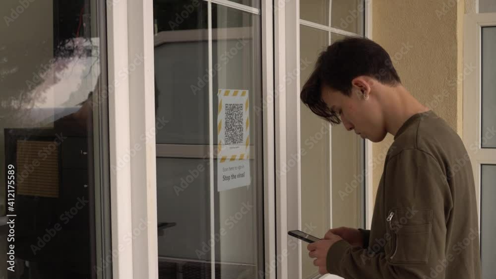 QR code on the doors at the entrance to the building. Scanning the QR ...
