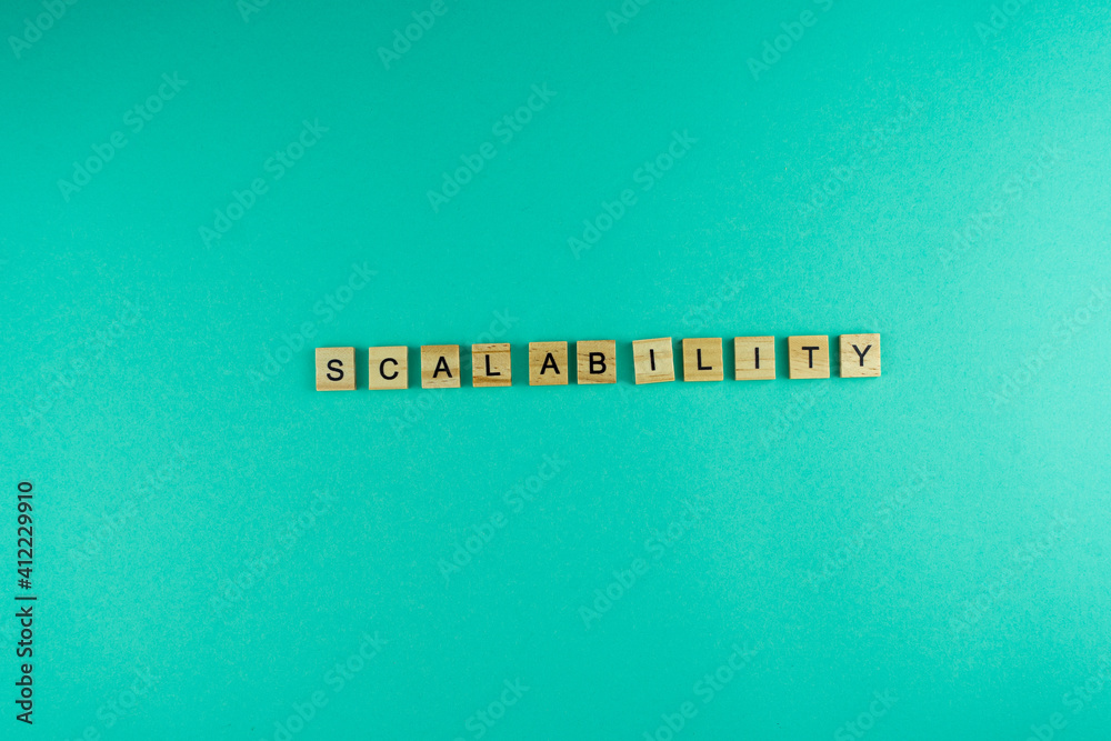 Word Scalability. The phrase is laid out in wooden letters. Top view ...