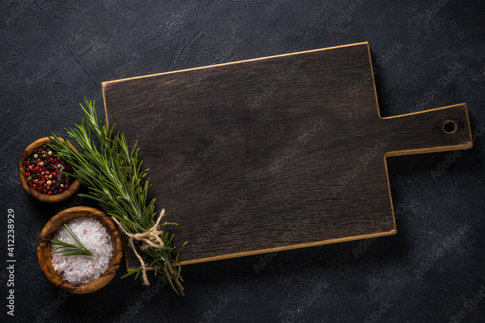 Food cooking background with wooden cutting board, herbs and spices on ...