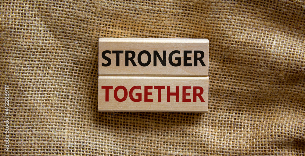 Stronger together symbol. Concept words 'stronger together' on wooden ...