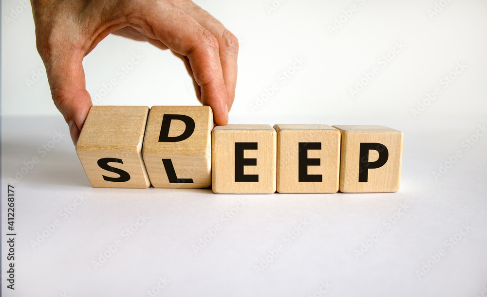 Sleep deep symbol. Doctor turns wooden cubes with words sleep deep ...