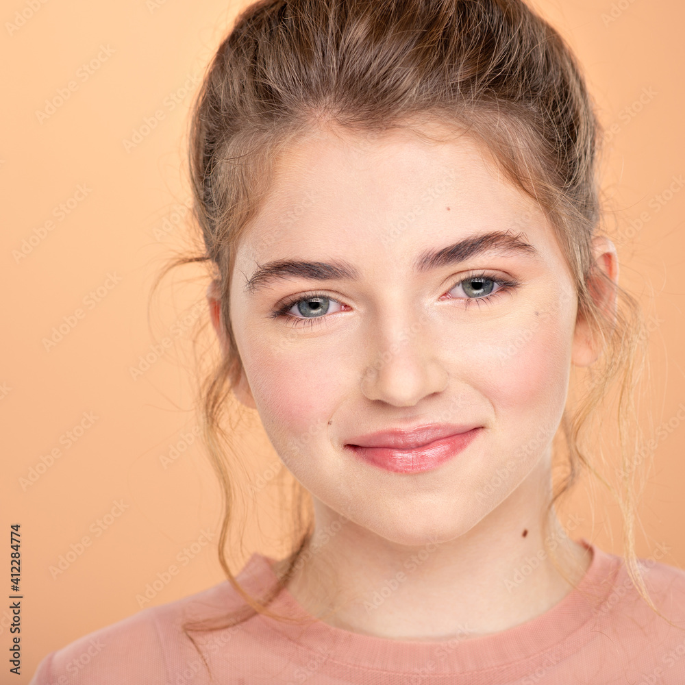 Closeup portrait of an young girl over colored background. Photo of a ...
