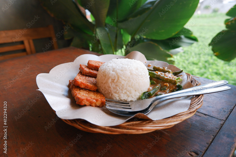 pecel rice on the table. Nasi Pecel is a traditional food from the ...