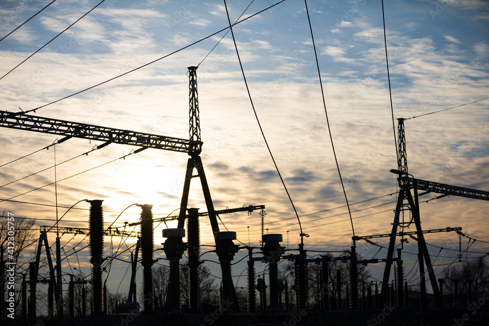 High-power electricity transmission station at sunset with an installed ...