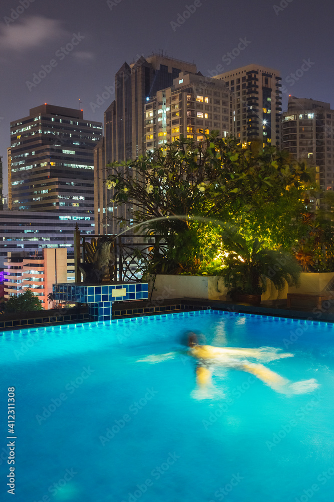 Man inside a swimming pool on Rooftop of a Skyscraper. Stock Photo ...