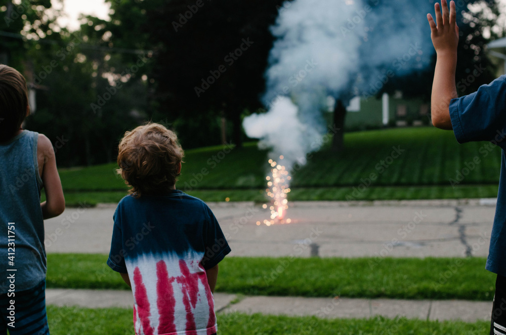 Boys and Fireworks Stock Photo | Adobe Stock