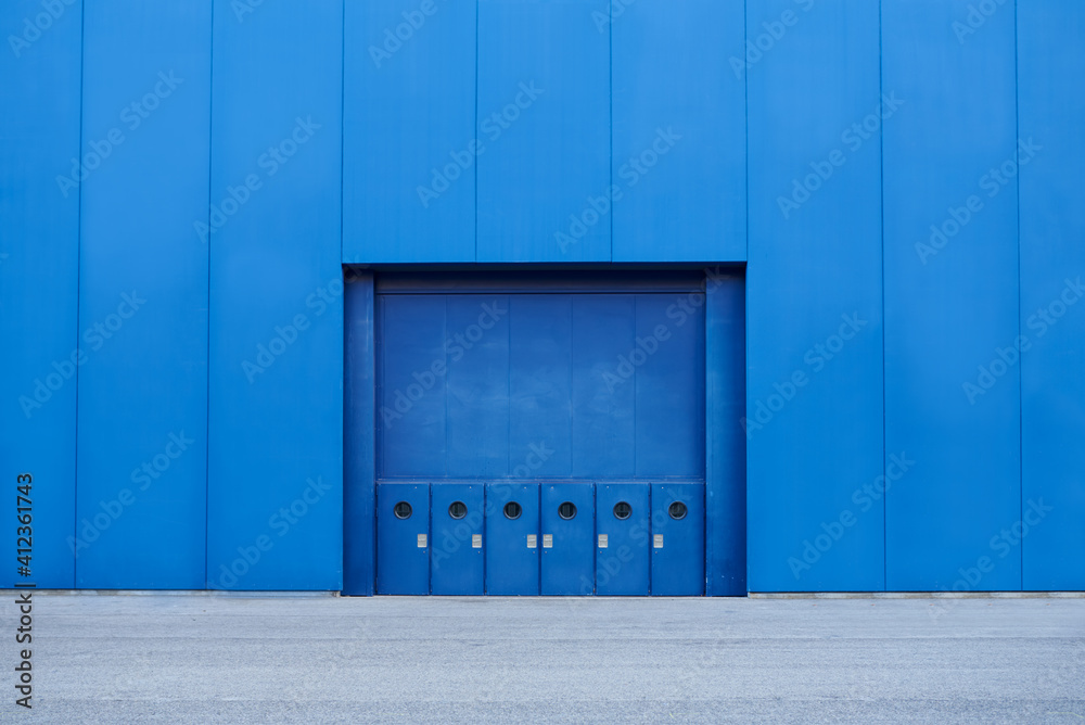 Entrance in blue wall. Stock Photo | Adobe Stock