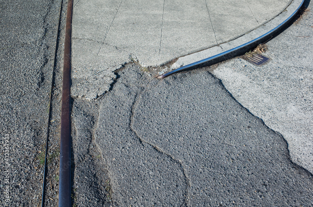Merging lines on urban sidewalk, street and railroad tracks foto de ...