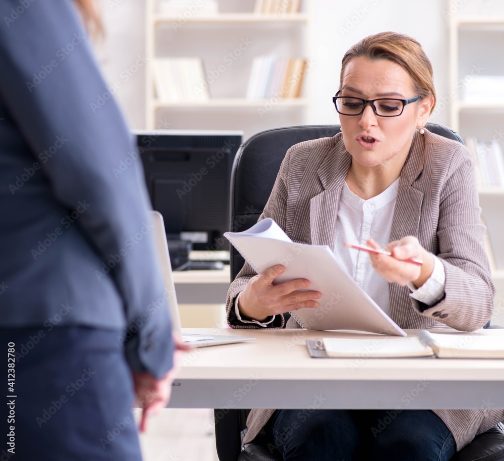 Angry boss dismissing employee for bad underperformance Stock Photo ...