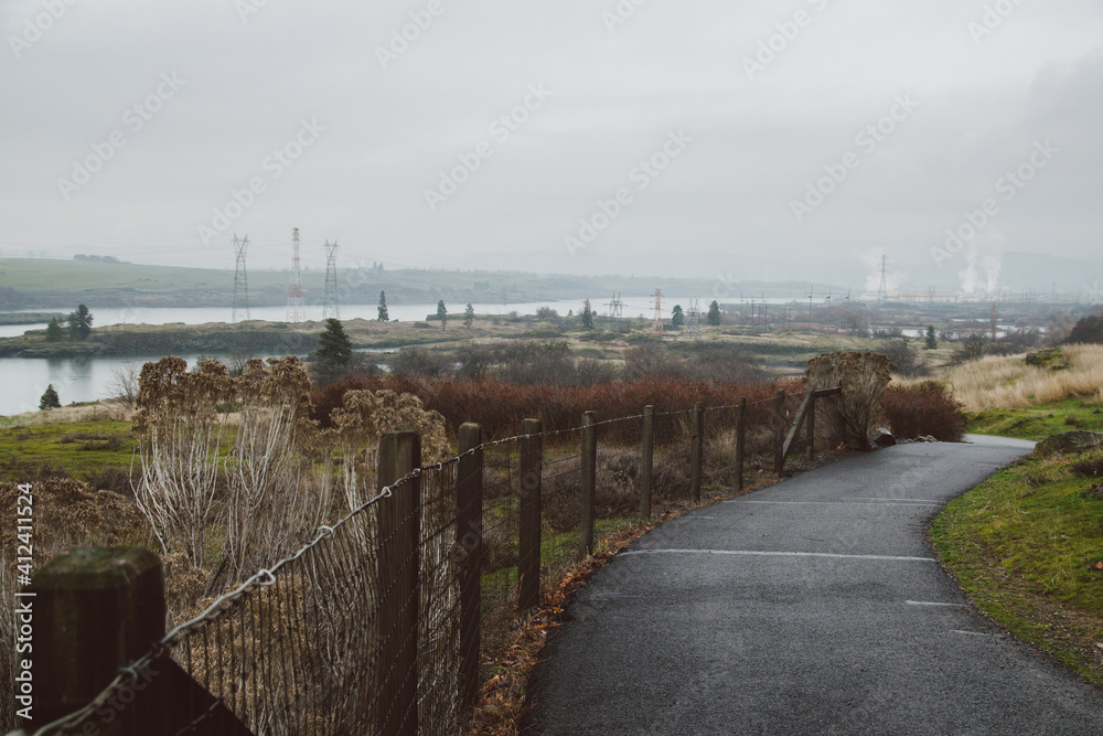 Pathway to an overcast industrial waterfront in Oregon. Stock Photo ...
