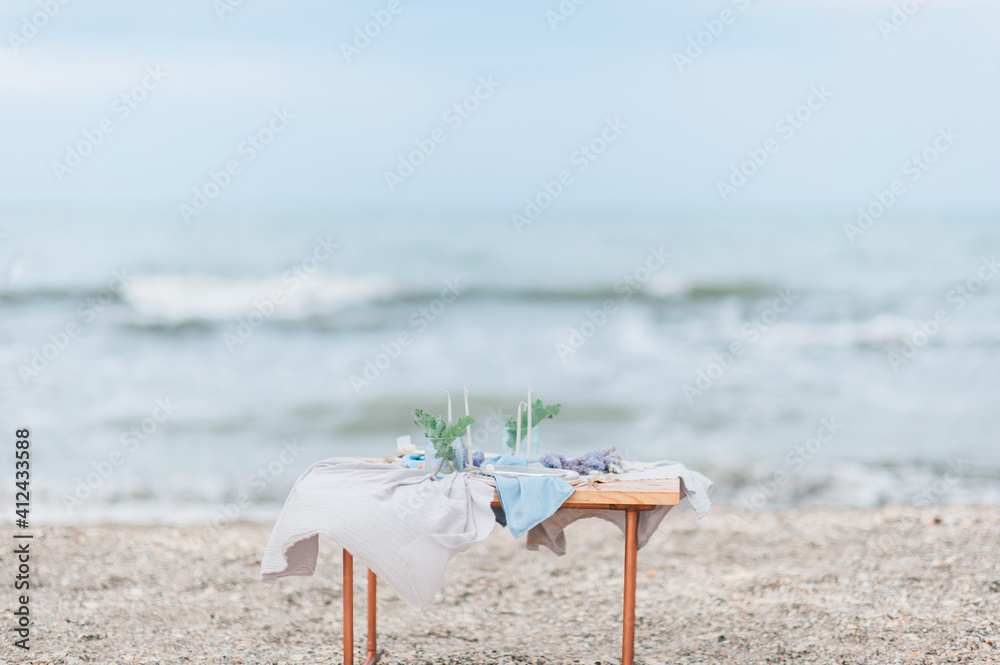 Table setup on the beach on summertime; Table for two on the beach ...