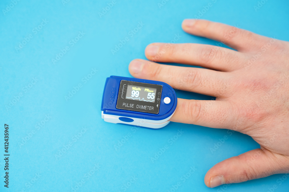 Pulse oximeter used to measure pulse rate and oxygen levels with hand ...
