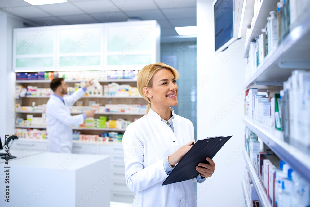 Pharmacists working in pharmacy shop or drugstore. Healthcare and ...