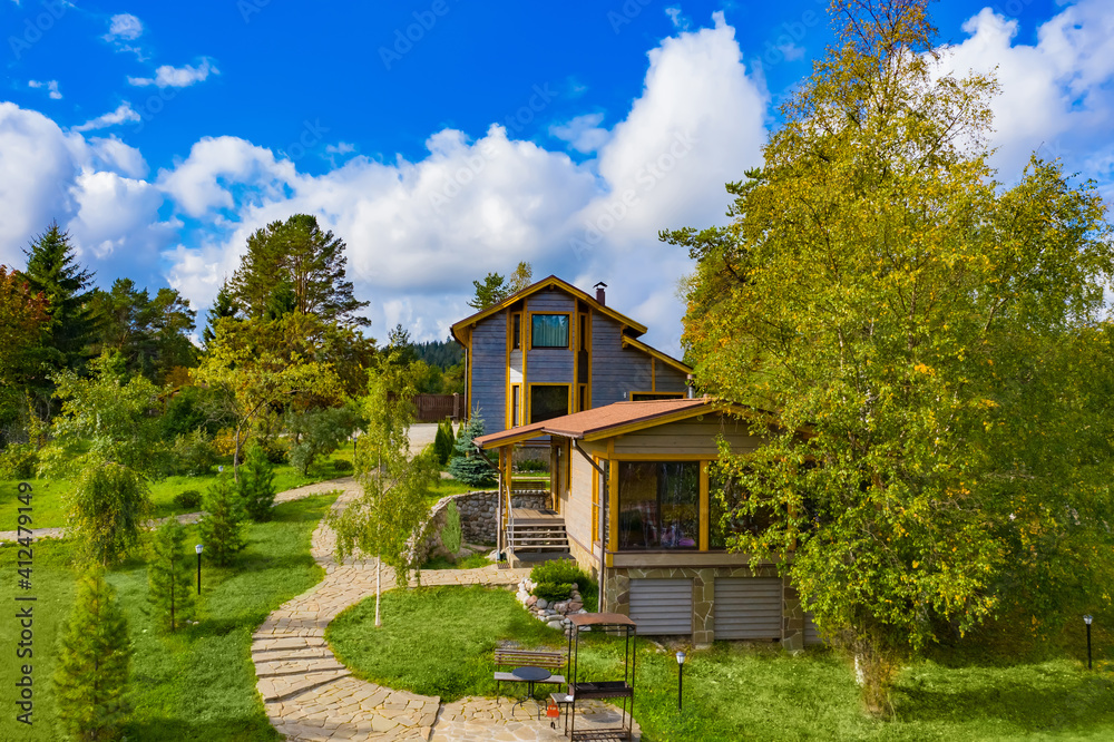 Territory of a country cottage. Wooden houses in a cottage town ...