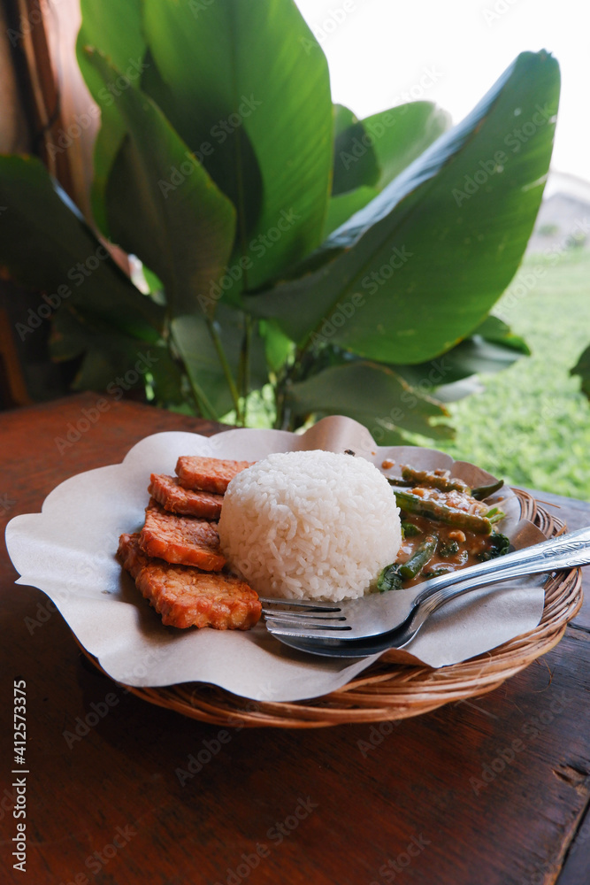 pecel rice on the table. Nasi Pecel is a traditional food from the ...