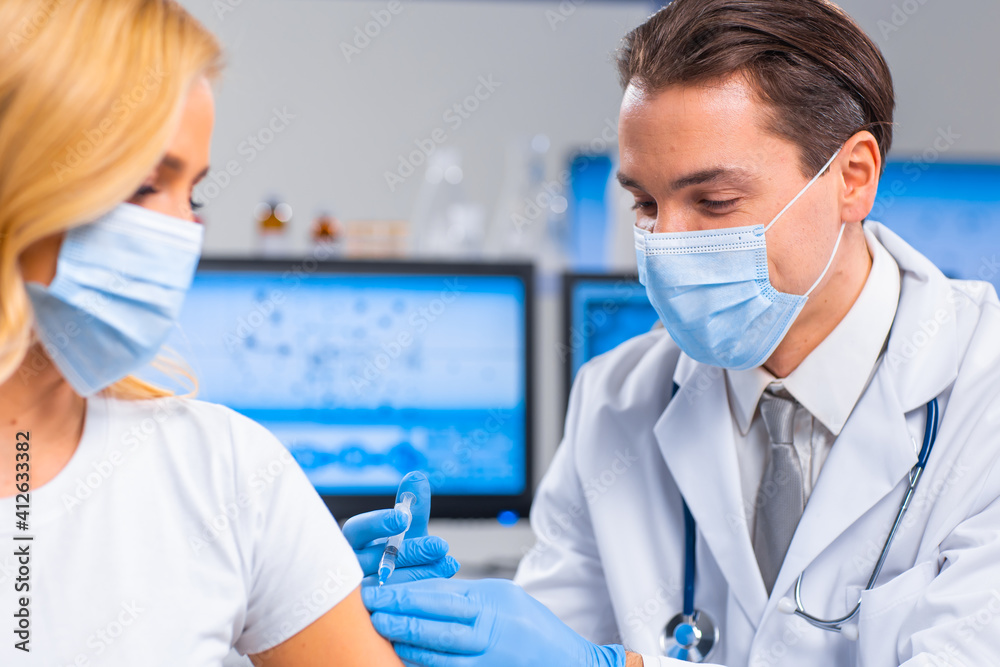 Professional doctor makes a coronavirus vaccine using a syringe and ...