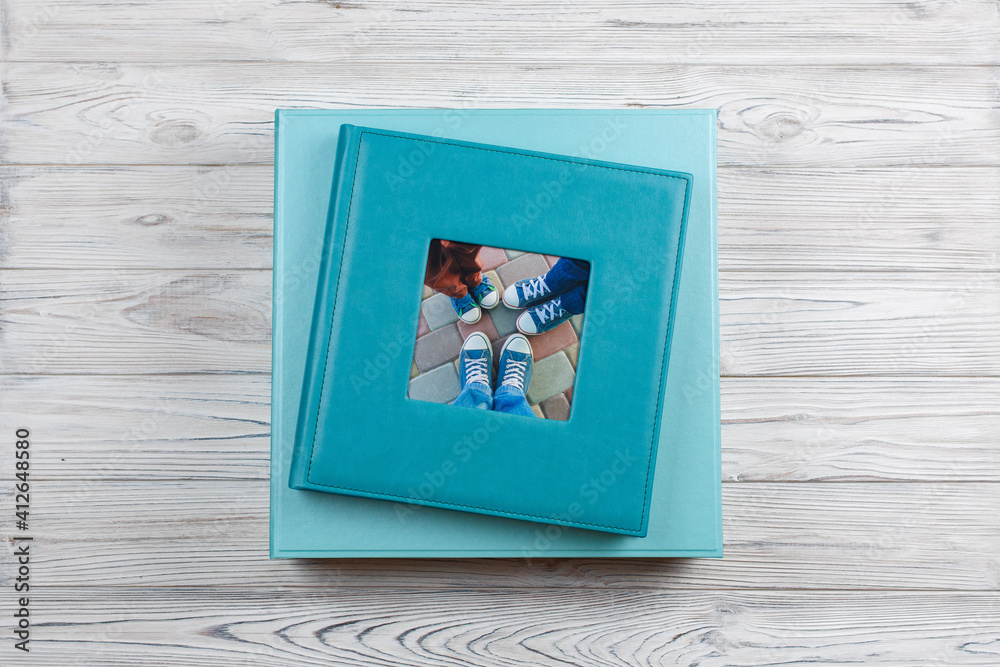 Blue leather photo album on cardboard box. family photo book with ...