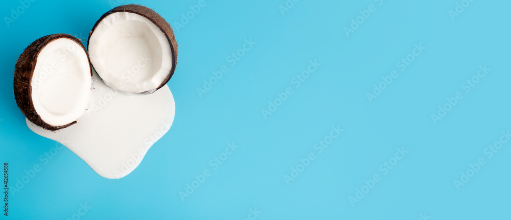 Coconut cream or butter with fresh coconuts on a blue banner background ...
