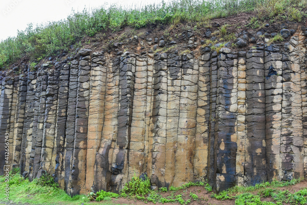 Terracotta columnar basalt columns on the tropical island of Penghu ...