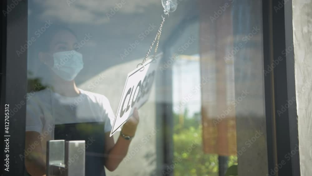 Coffee shop concept of 4k Resolution. Asian girl is flipping the sign ...