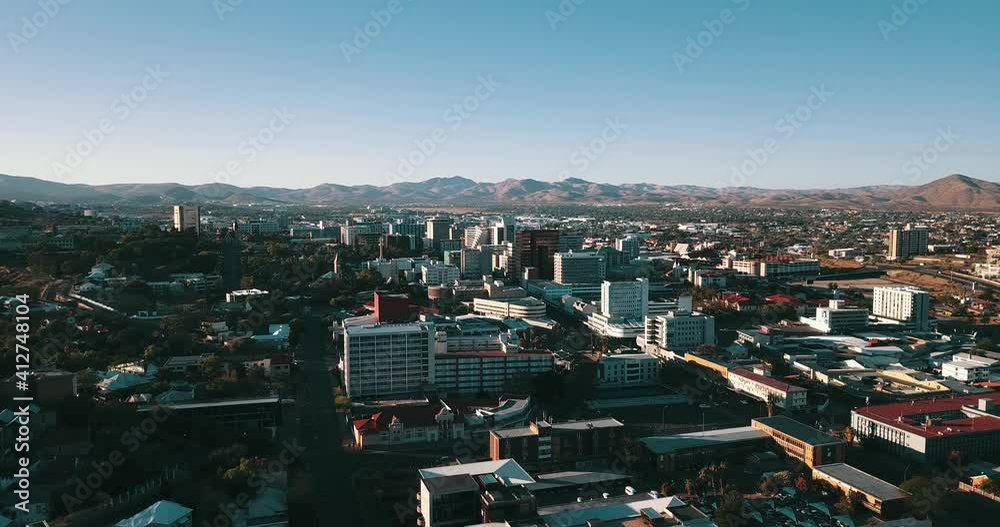 Stockvideo 4K sunrise aerial footage of savanna hills, Windhoek central ...
