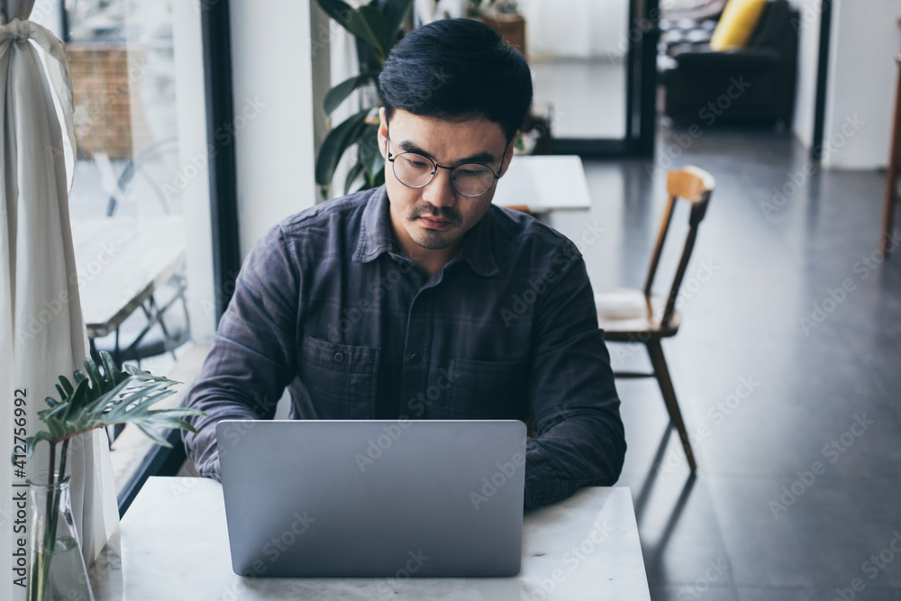 Fotografia do Stock: asian man work using computer hand typing laptop ...