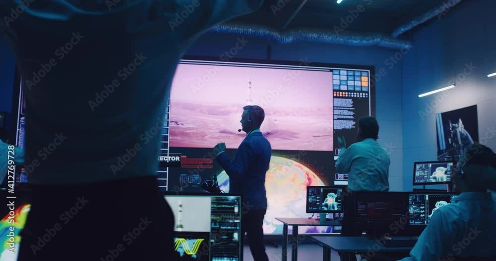 Team of operators celebrating spacecraft launch Stock Video | Adobe Stock