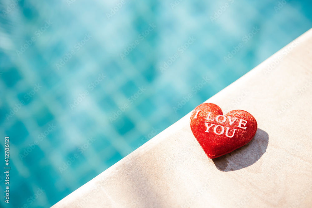 Red heart with i love you message on swimming pool edge with space on ...