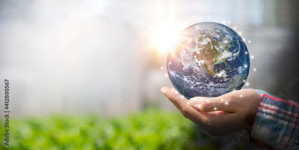 Woman holding earth in her hand, save the earth and energy concept ...