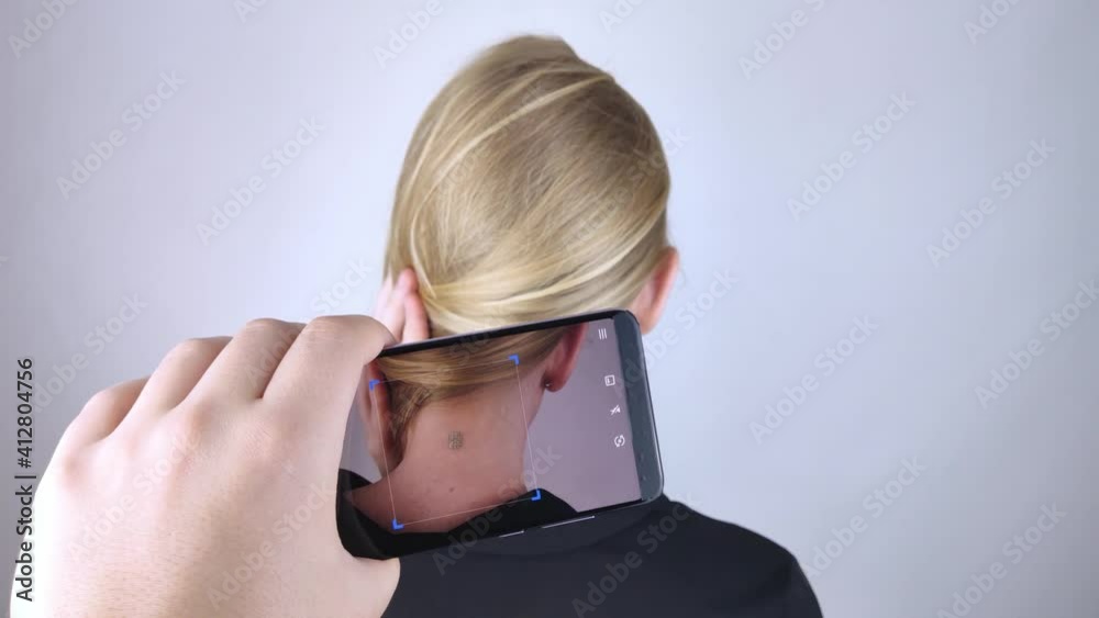 Vídeo do Stock: The woman shows his neck with a chip implanted which is ...