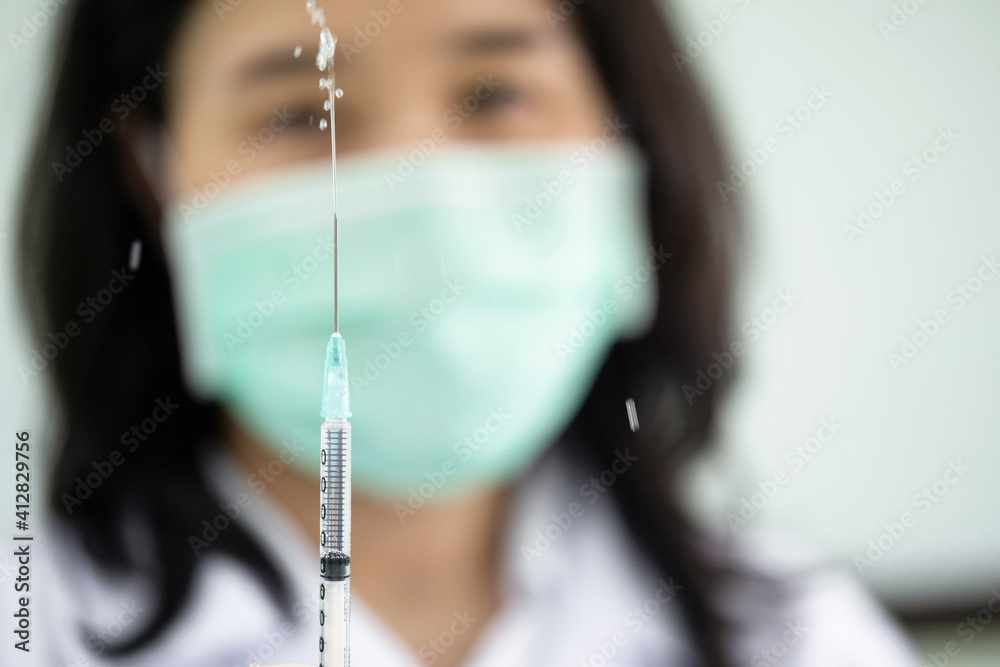 Remove air bubble from syringe before injection vaccine to patient ...