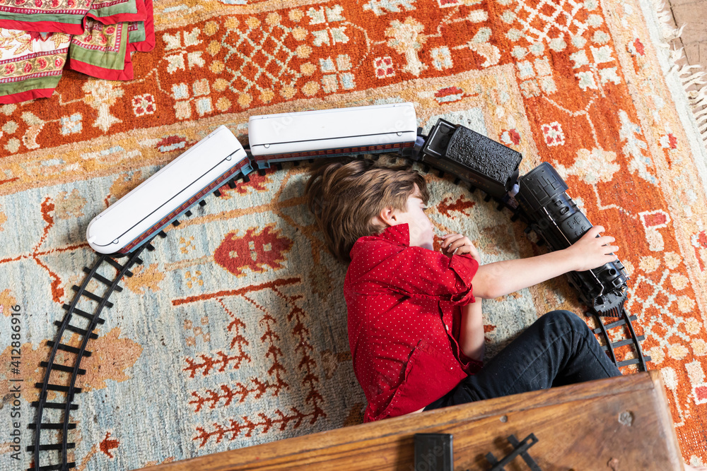 overhead view of young boy playing with his train Stock Photo | Adobe Stock