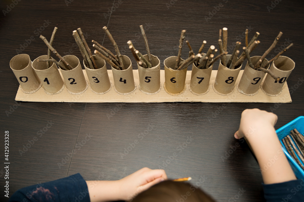 Little child doing simple math exercises. Early education, counting ... Little child doing simple math exercises. Early education, counting ...