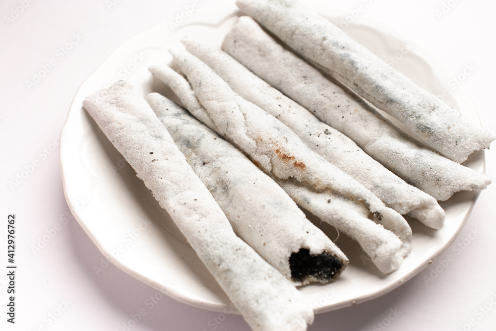 Til pitha a traditional food of Assam isolated stock image. Stock Photo ...
