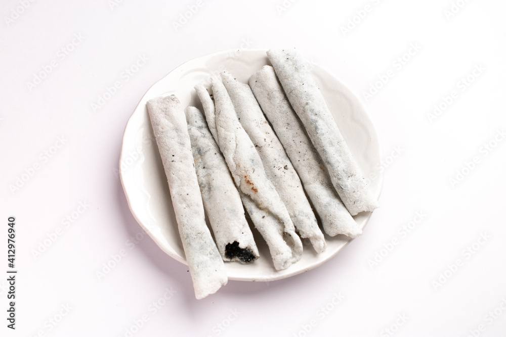 Til pitha a traditional food of Assam isolated stock image. Stock Photo ...