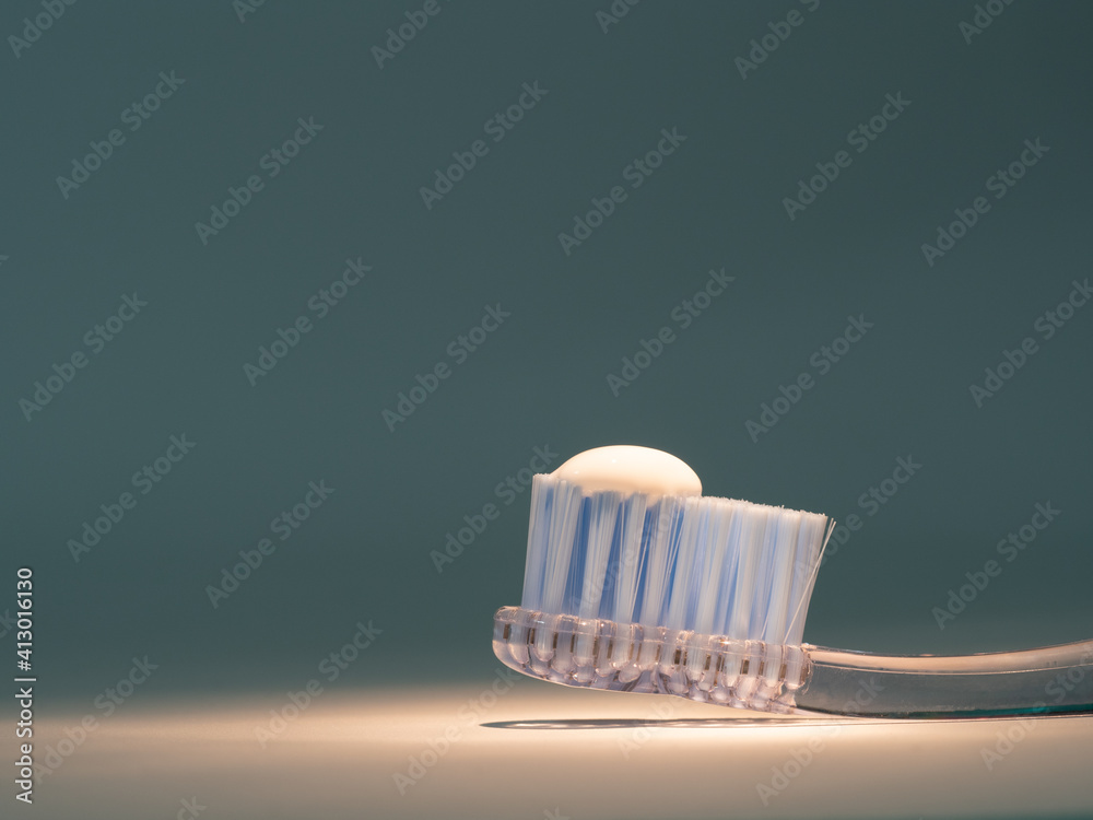 toothbrush with recommended amount of toothpaste equivalent to the size ...