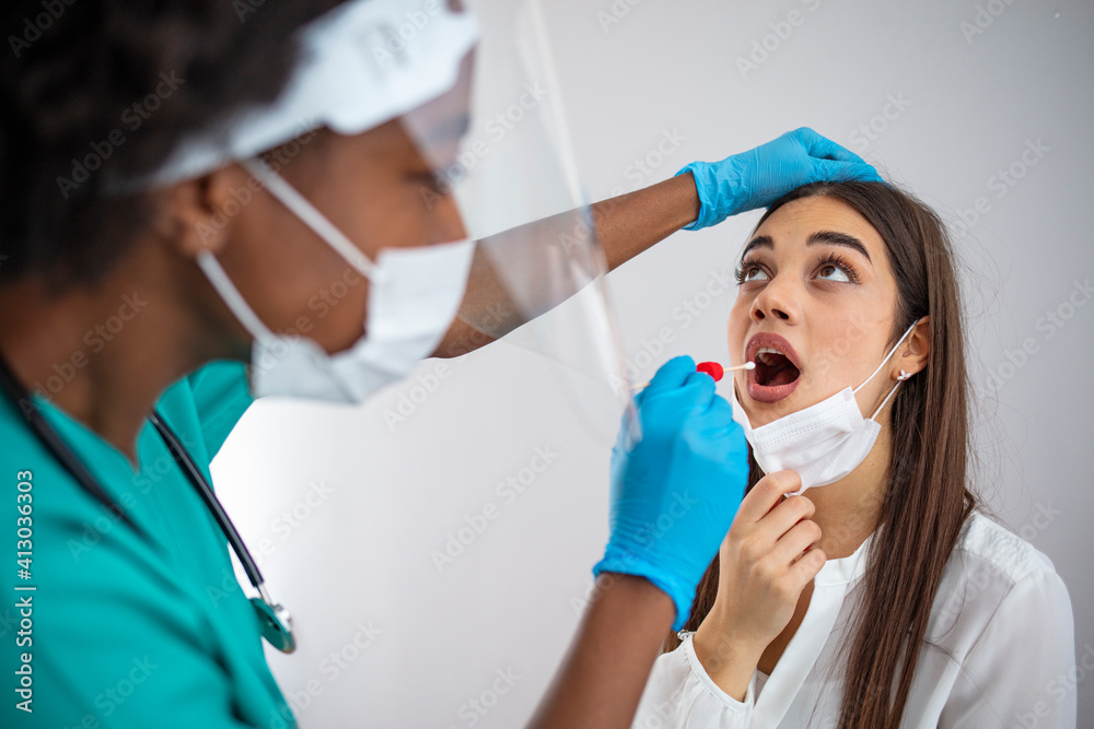 Close-up of a woman having PCR test at medical clinic. Close-up of ...