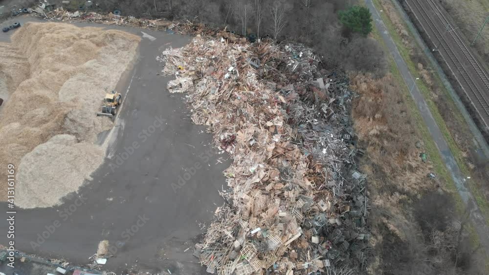 Tractor Front Loader Moving Sawdust at Wood Waste Landfill, Aerial ...
