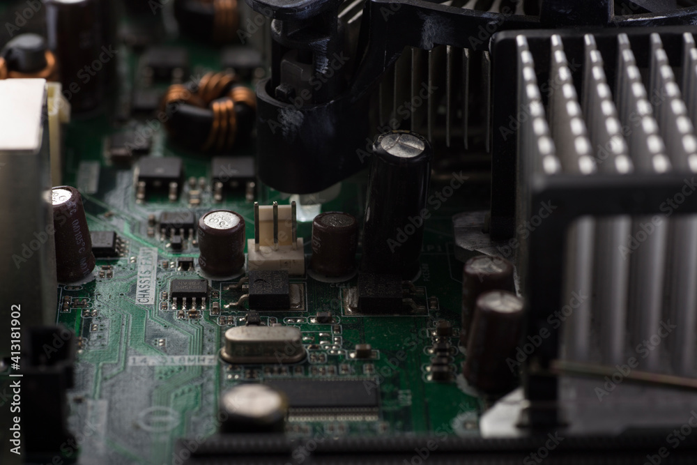 capacitors and transistors on the motherboard are green Stock Photo ...