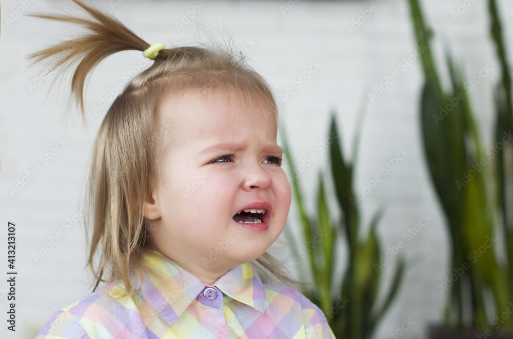 Sad little girl toddler crying. Lonely and unhappy baby girl with funny ...