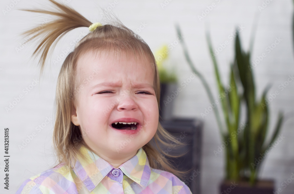 Sad little girl toddler crying. Lonely and unhappy baby girl with funny ...