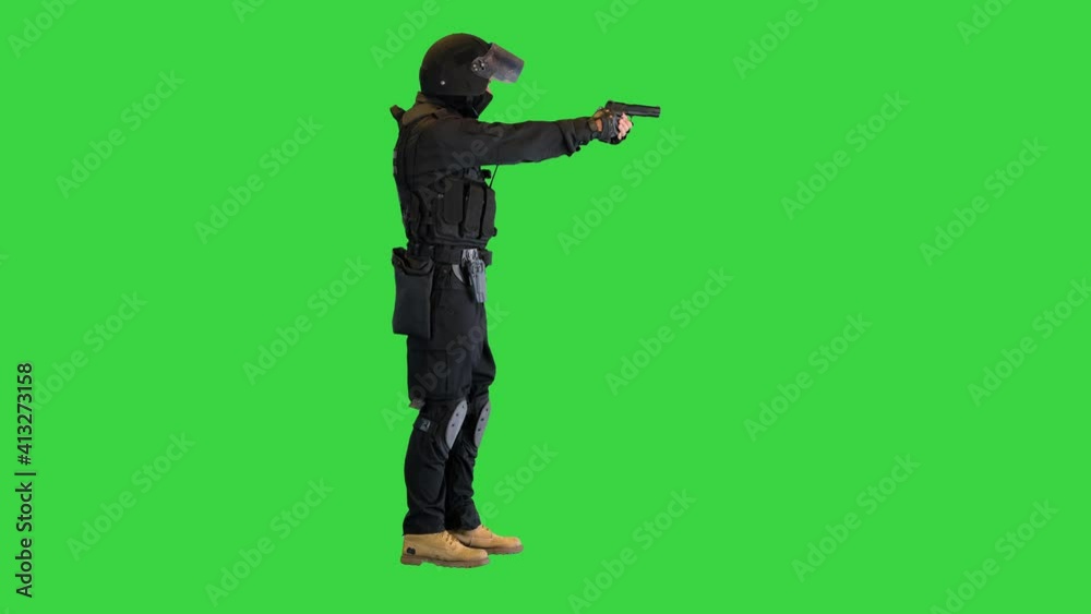 Police tactical unit aiming with a hand gun on a Green Screen, Chroma ...