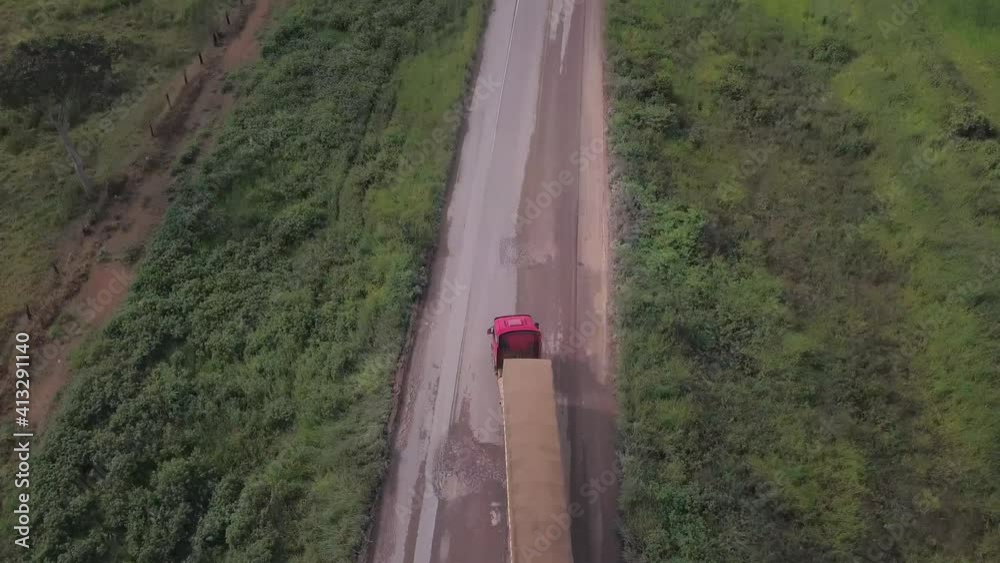 Drone aerial view of double semi truck loaded with soybeans driving ...