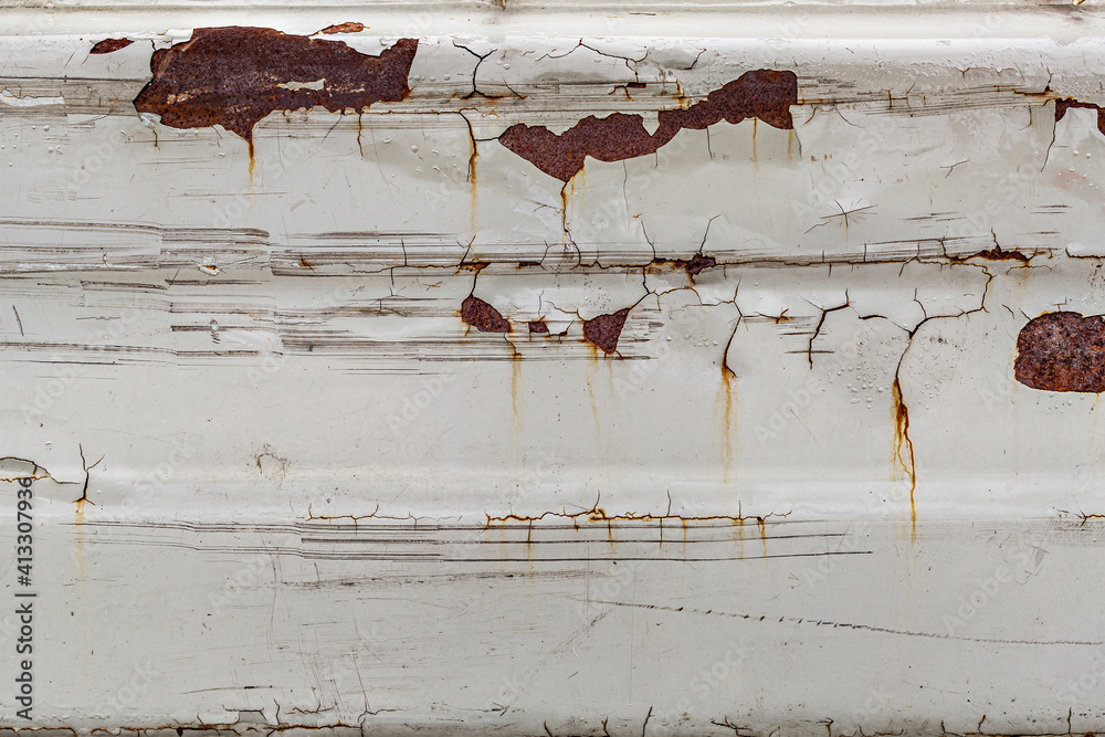 Destroyed uneven worn enamel on old gray retro ruined metal door ...