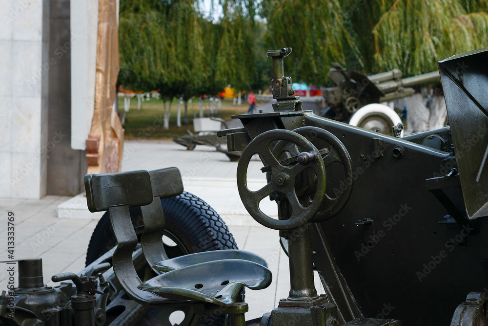 Artillery, gun mechanism controls, green artillery cannon close - up in ...