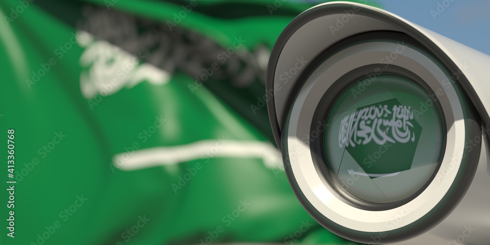 National flag of Saudi Arabia and CCTV camera. Surveillance system ...