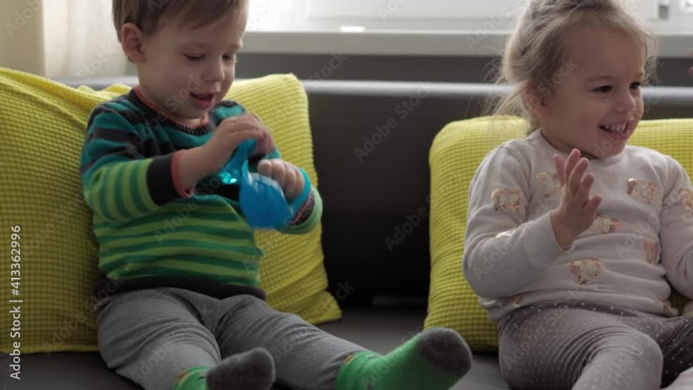 authentic baby hands with blue and red slime. Girl and boy preschool ...