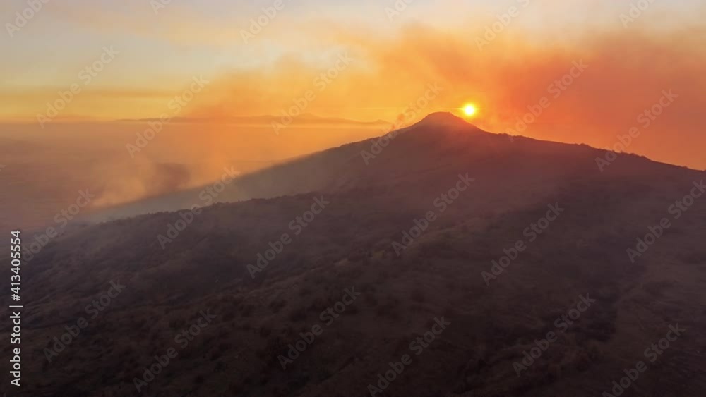 Fire orange smoke cloud sun shine sky mountain hilly horizon scenery ...