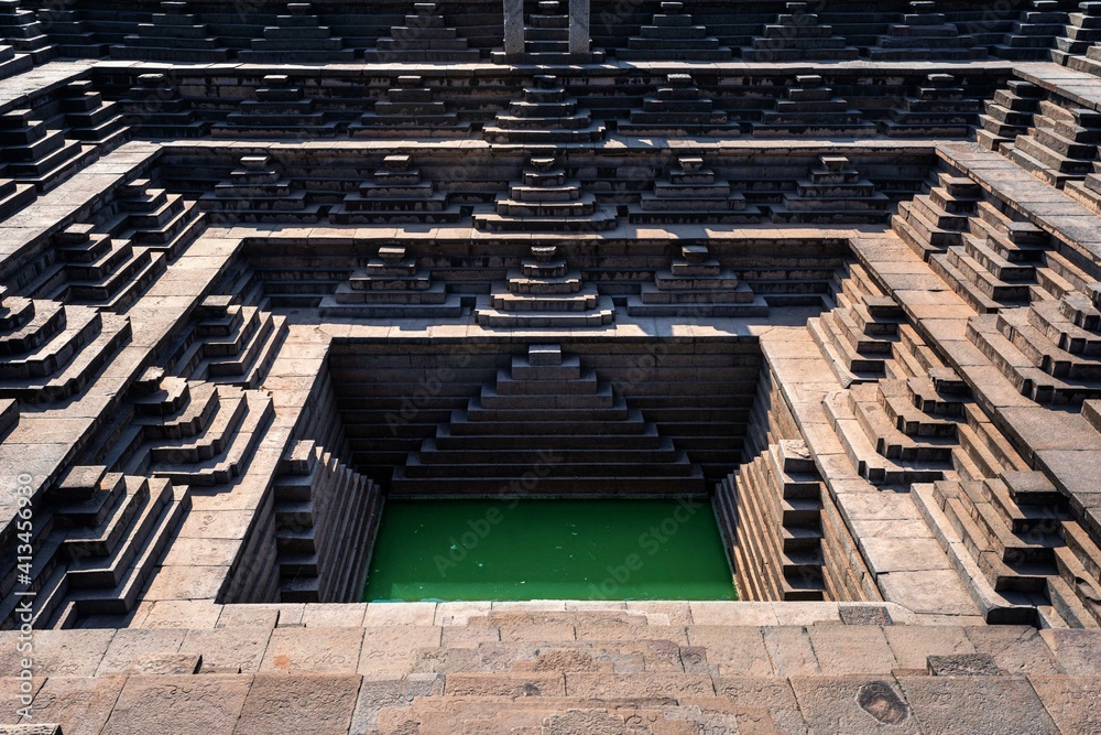 Pushkarini Stepwell with aqueducts. Stepped tank in the royal enclosure ...