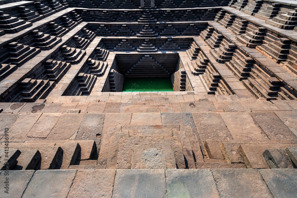 Pushkarini Stepwell with aqueducts. Stepped tank in the royal enclosure ...